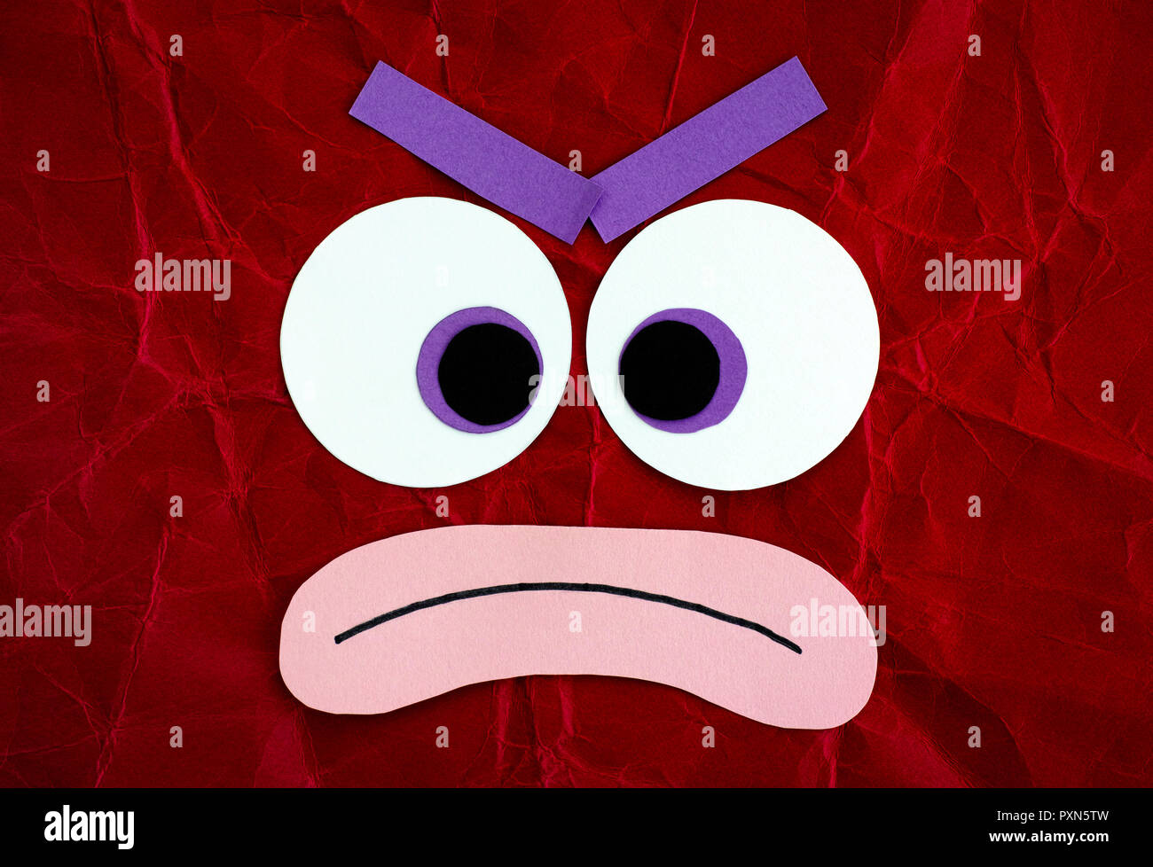 Angry emotional face made from paper. Red background Stock Photo - Alamy