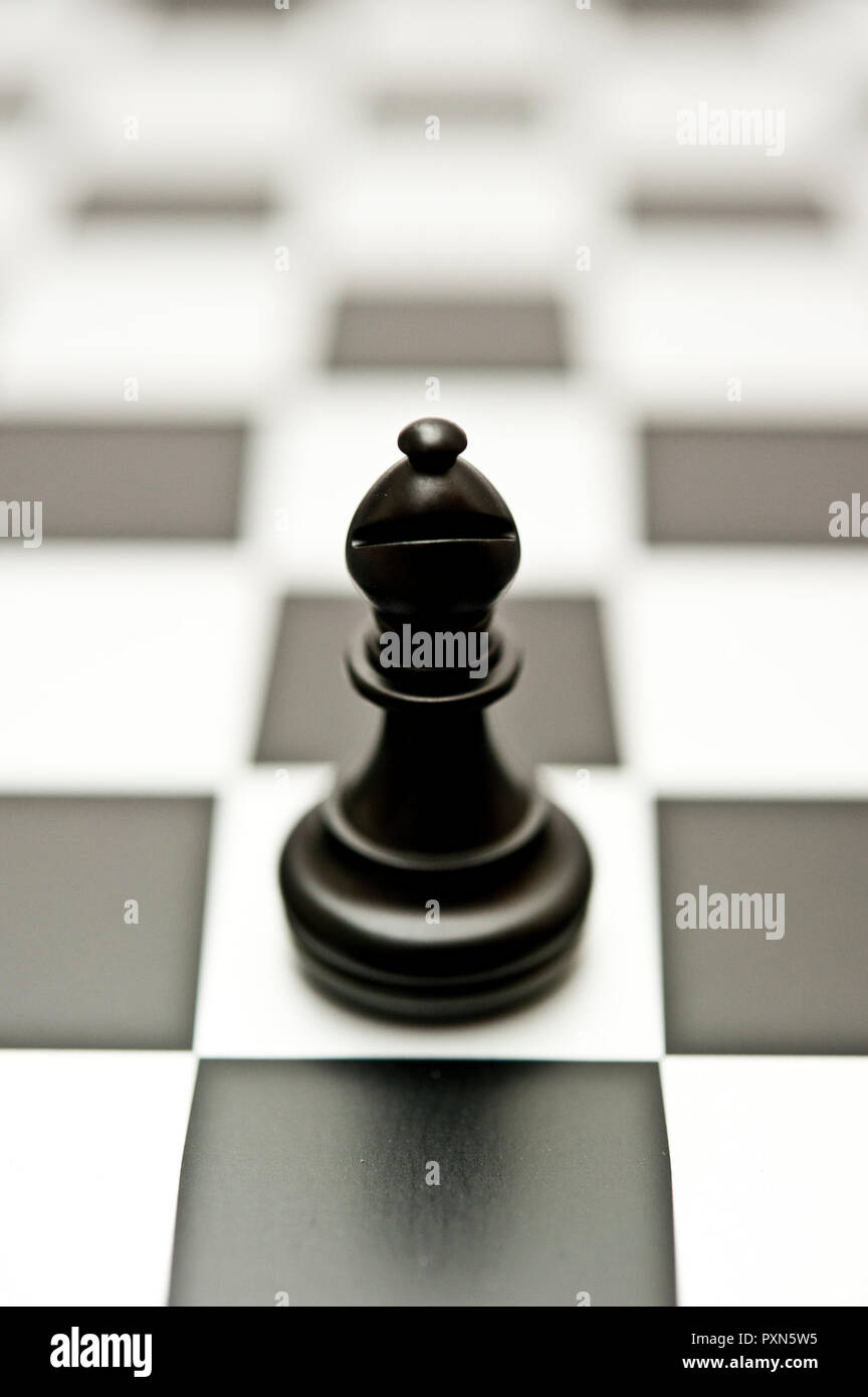 black chess Bishop on a chessboard Stock Photo - Alamy