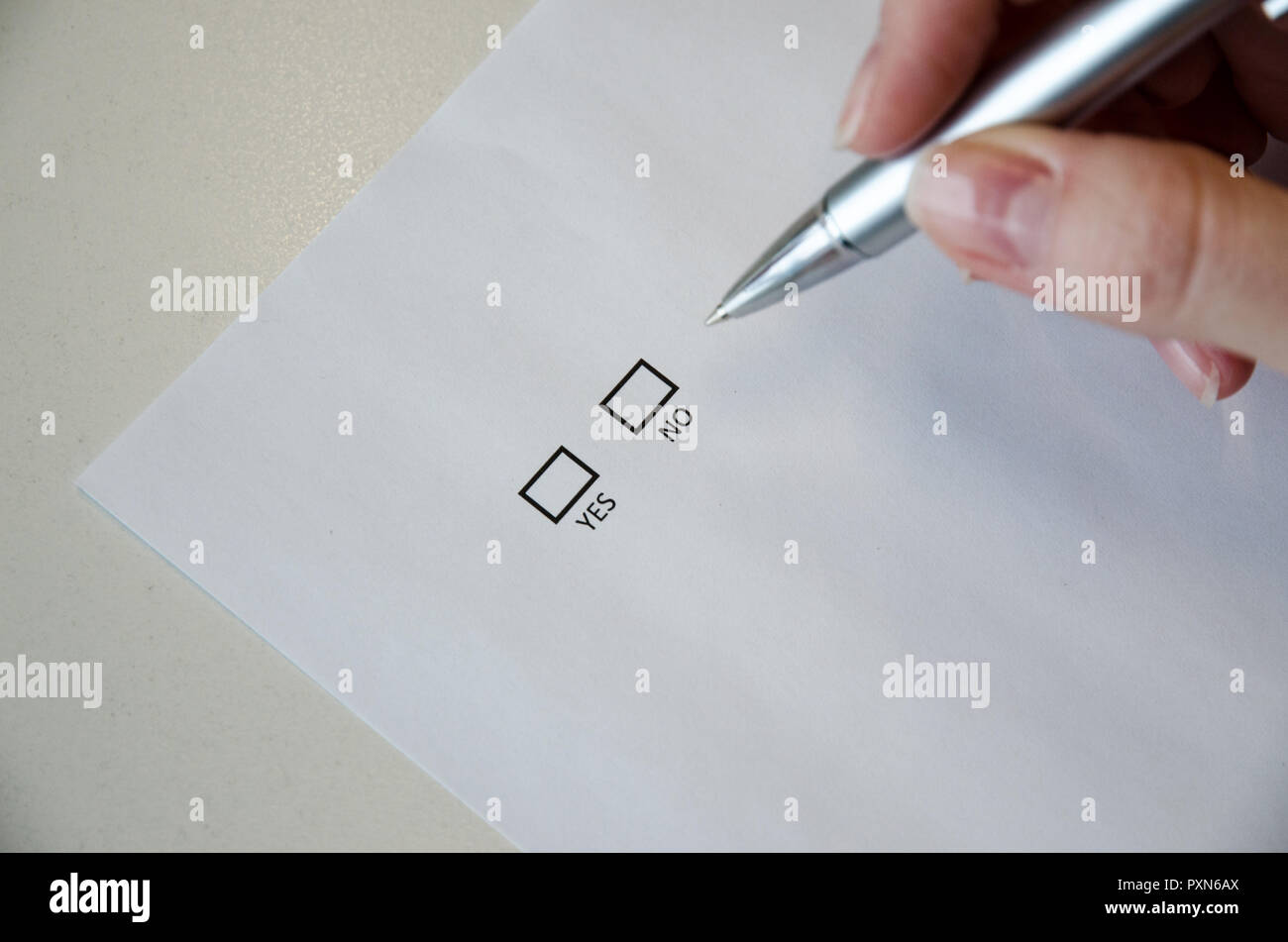 white questionnaire and hand with pen Stock Photo - Alamy
