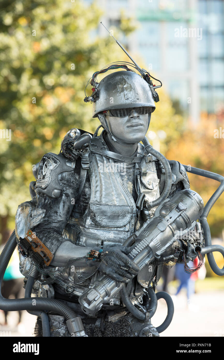 Living statue performer entertaining tourists in places such as here on ...