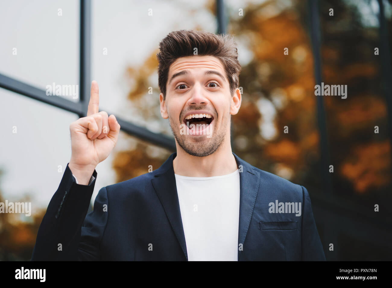 Portrait of young thinking pondering businessman having idea moment ...