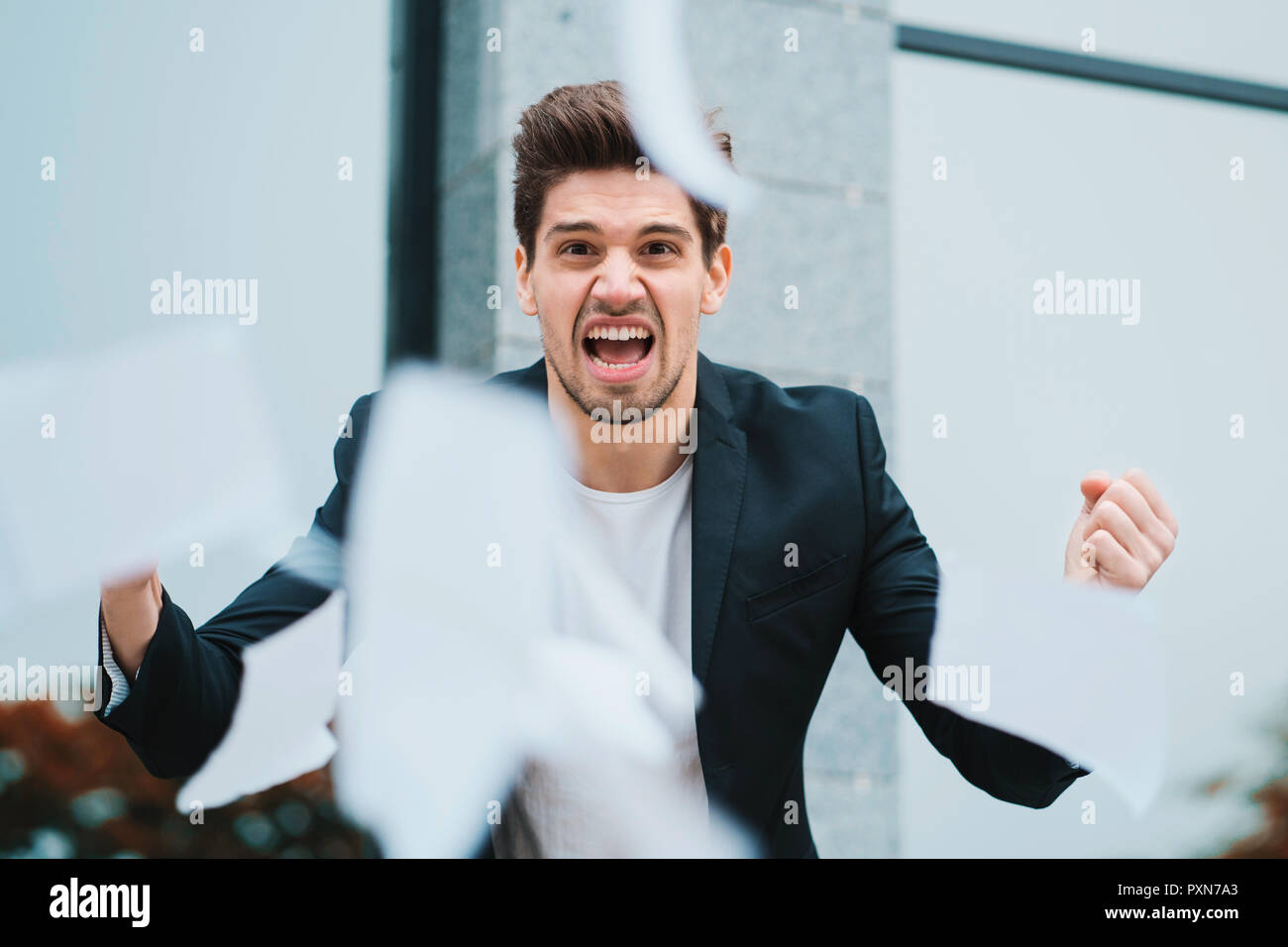 Angry furious male office worker throwing crumpled paper, having ... Angry furious male office worker throwing crumpled paper, having ...