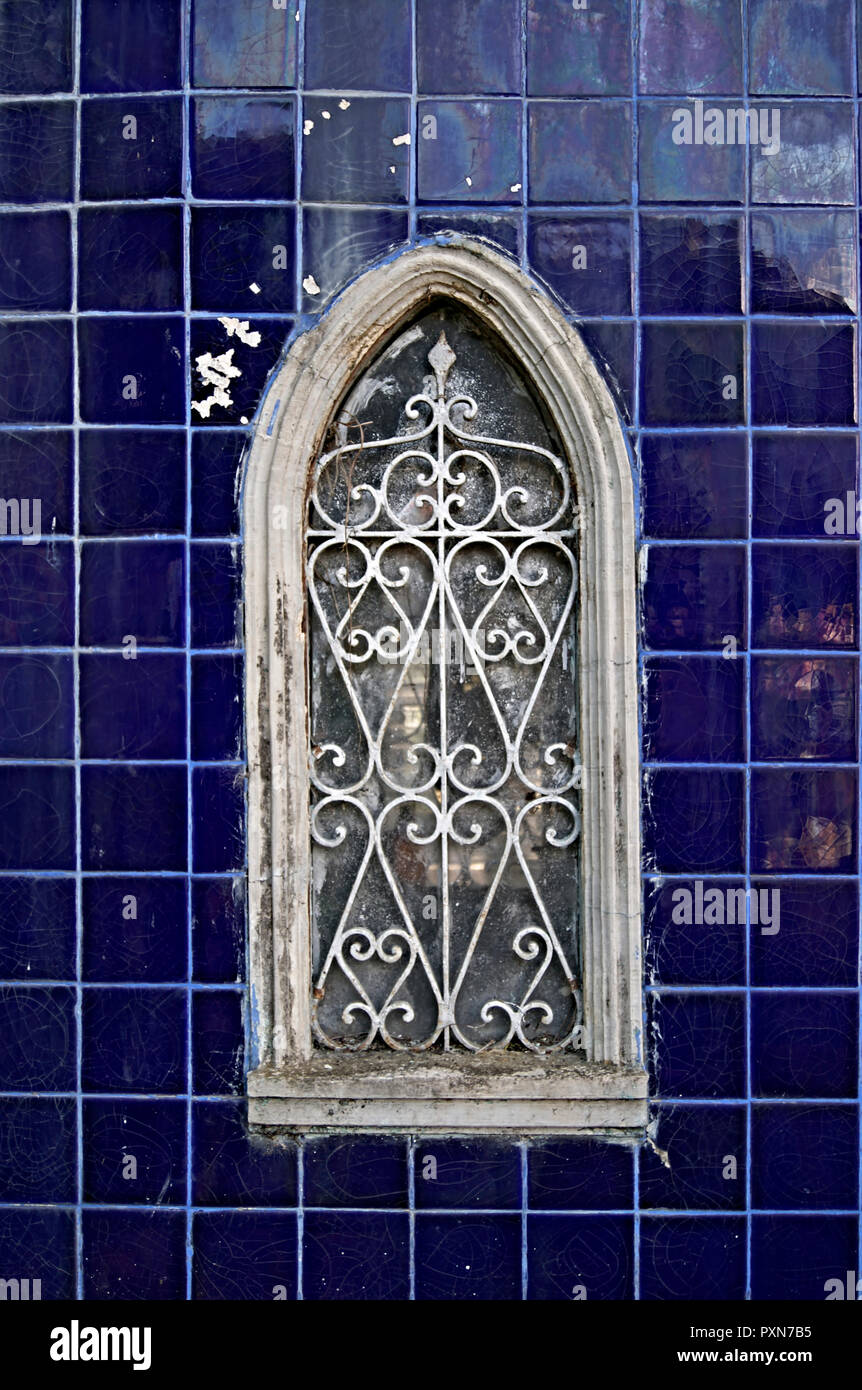 Old abandoned tomb window in blue tile background in Xalapa cemetery ...