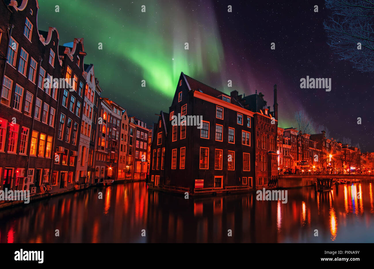 City scenic in Amsterdam the Netherlands at night with colored lights ...