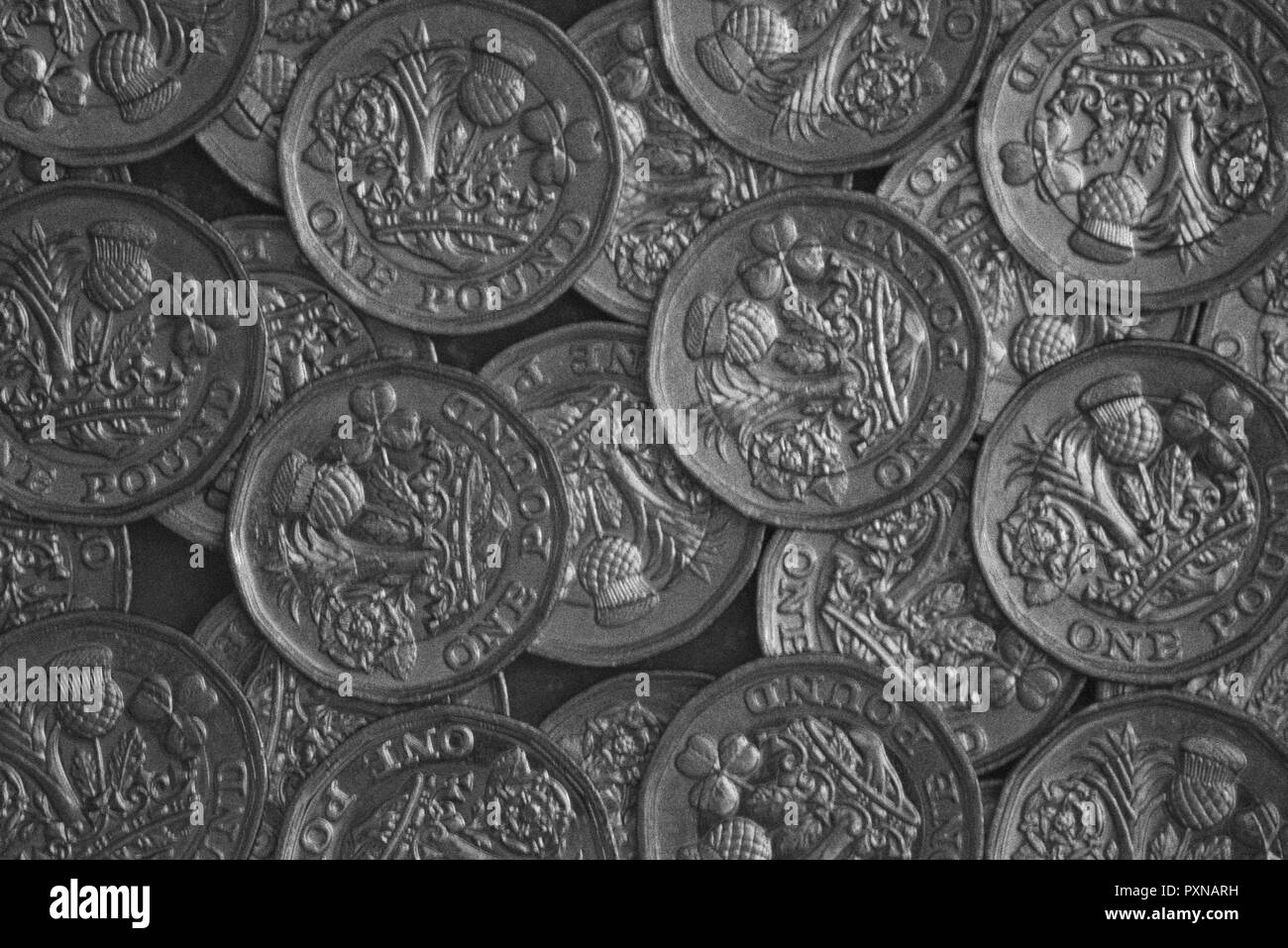 Uk one pound coins Black and White Stock Photos & Images - Alamy