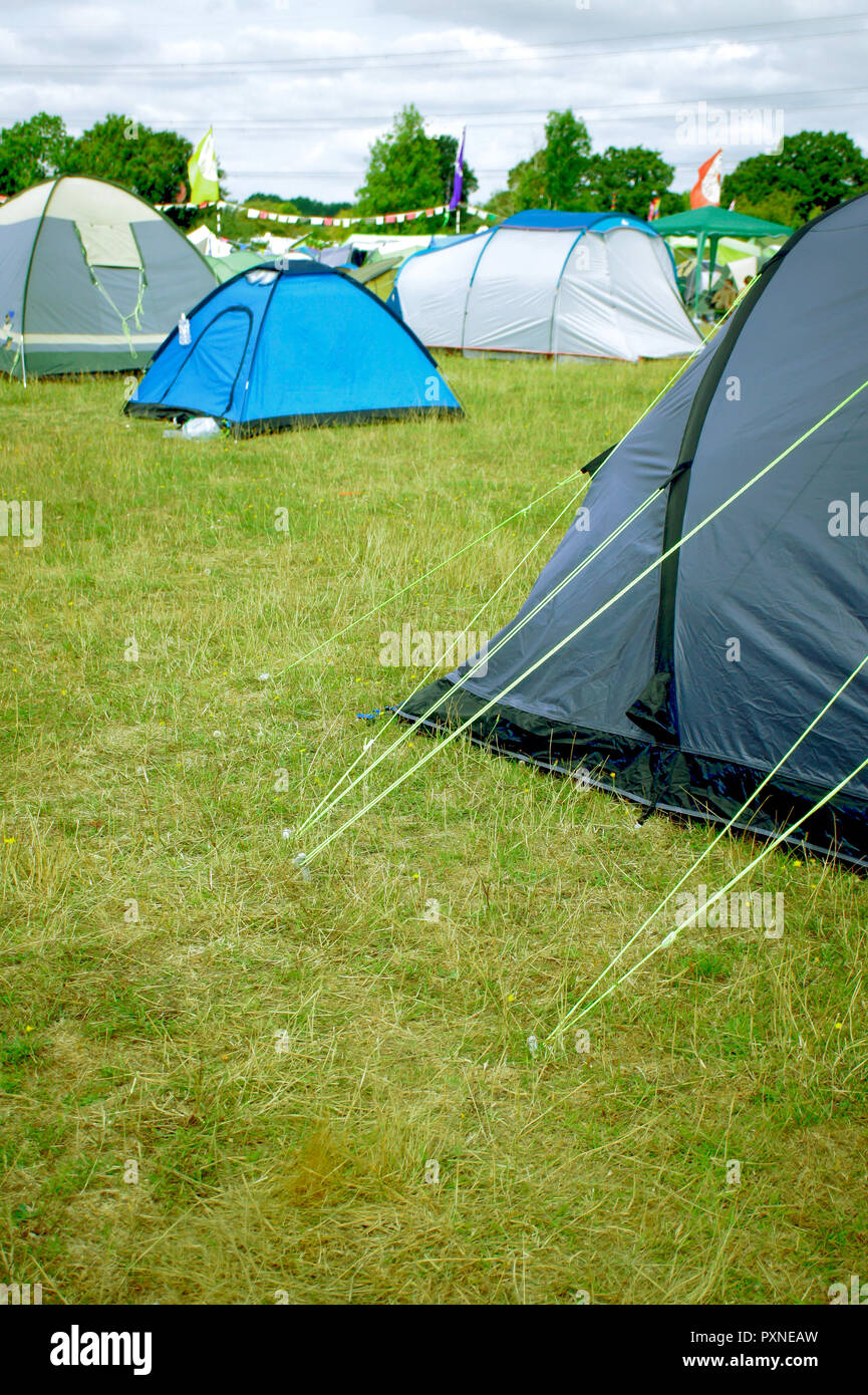 Colourful tents in a field at a summer festival in England Stock Photo ...