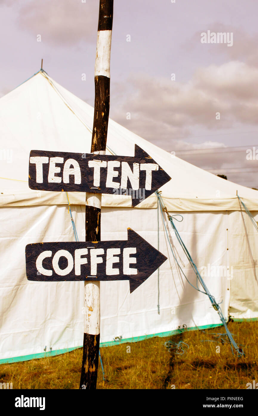 Signs for a tea and coffee tent at a festival in England with a warm ...