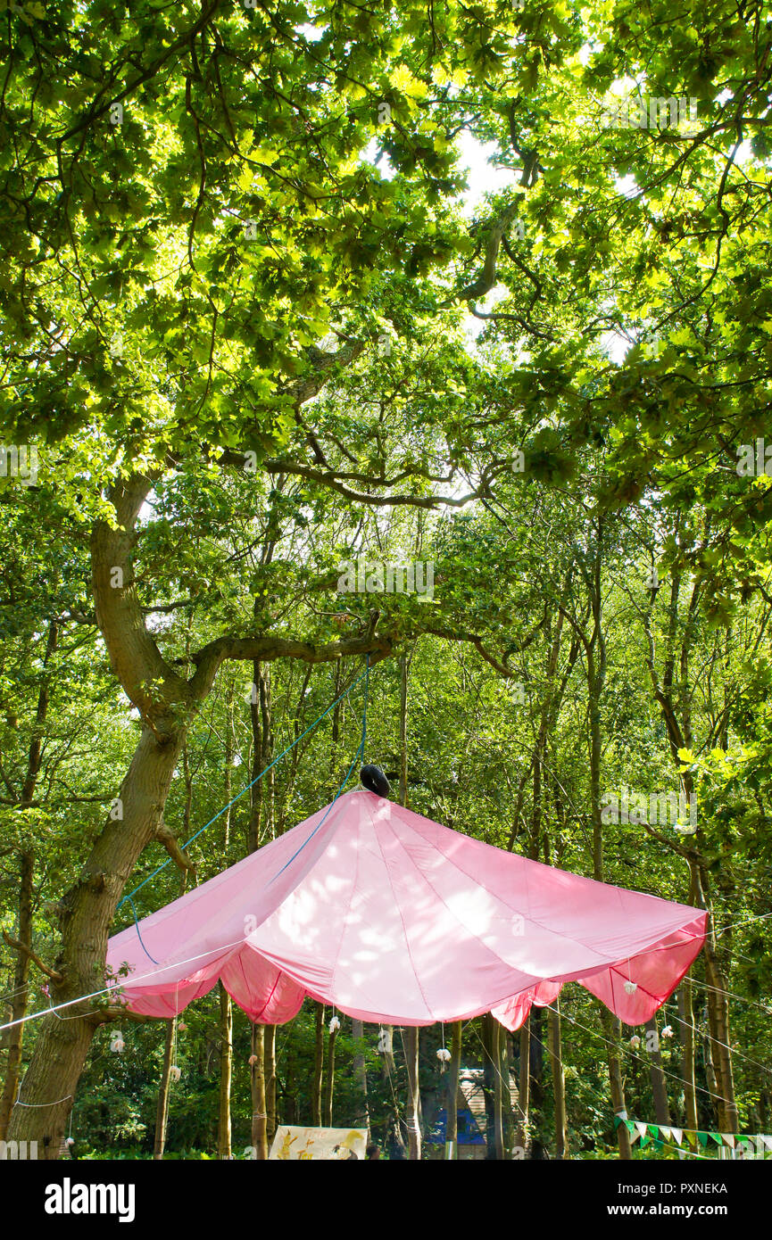 A red hanging canopy in a forest in the UK Stock Photo - Alamy