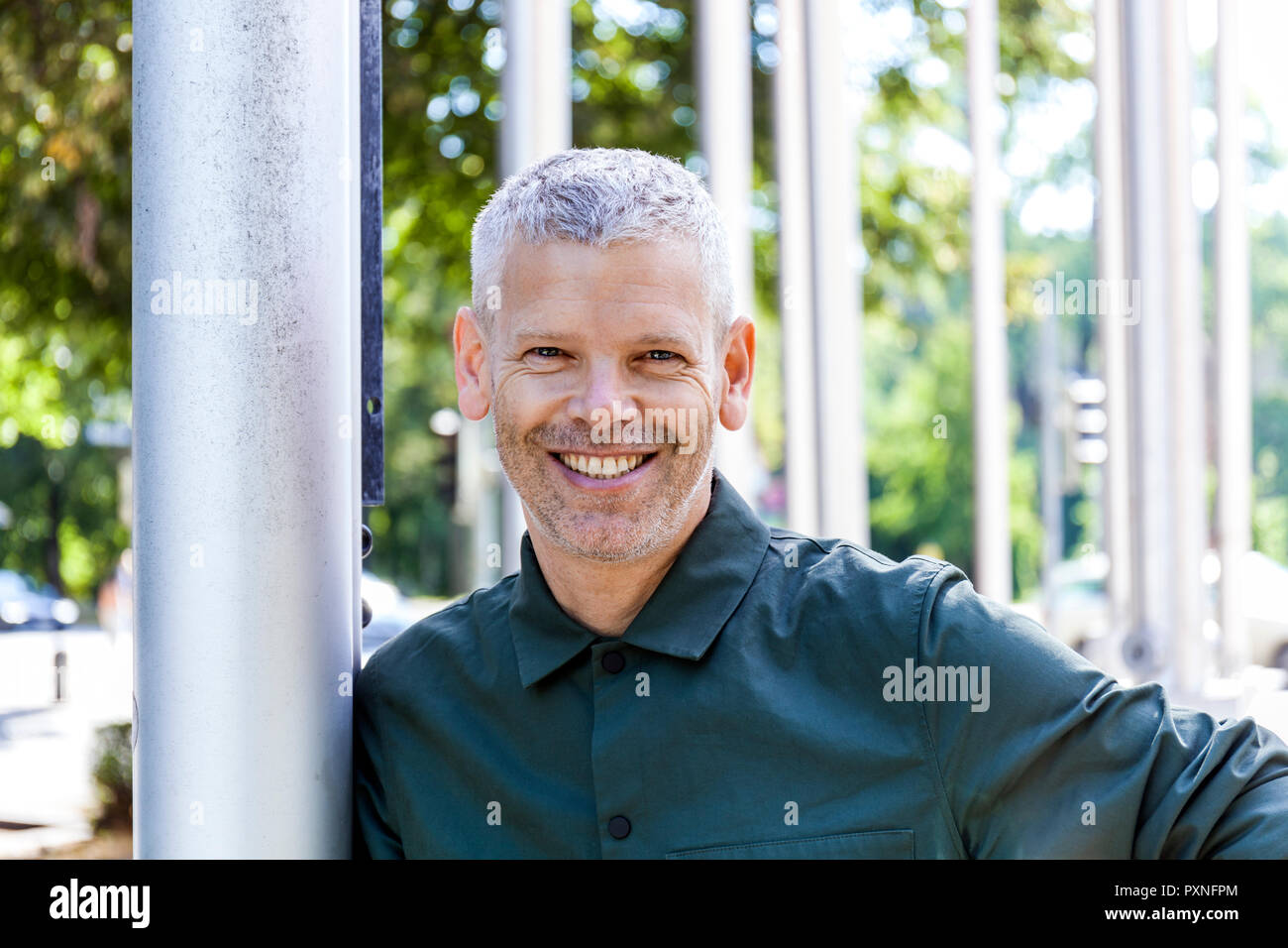 Lean against pole hi-res stock photography and images - Alamy