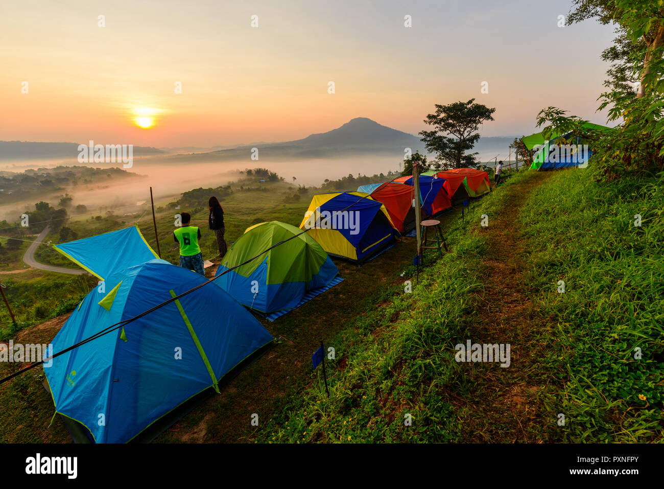 camping on high mountain with mist in sunrise time Stock Photo - Alamy