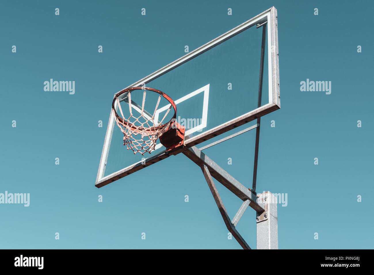 Basketball ring and board. Low angle view. Filtered image Stock Photo ...