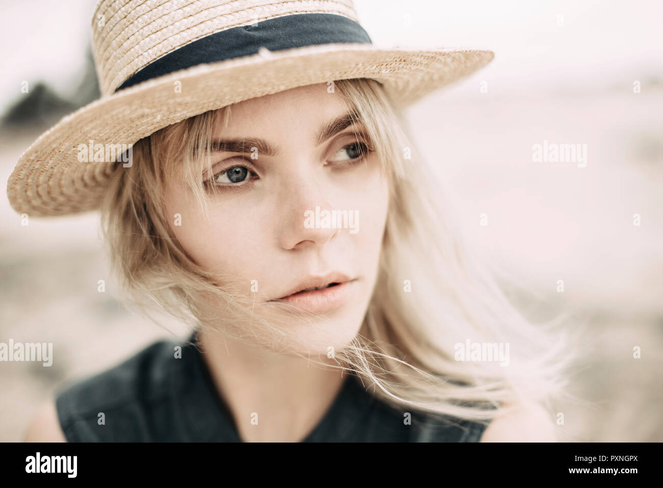 Portrait daydreaming young woman wearing straw hat nature hi-res stock ...