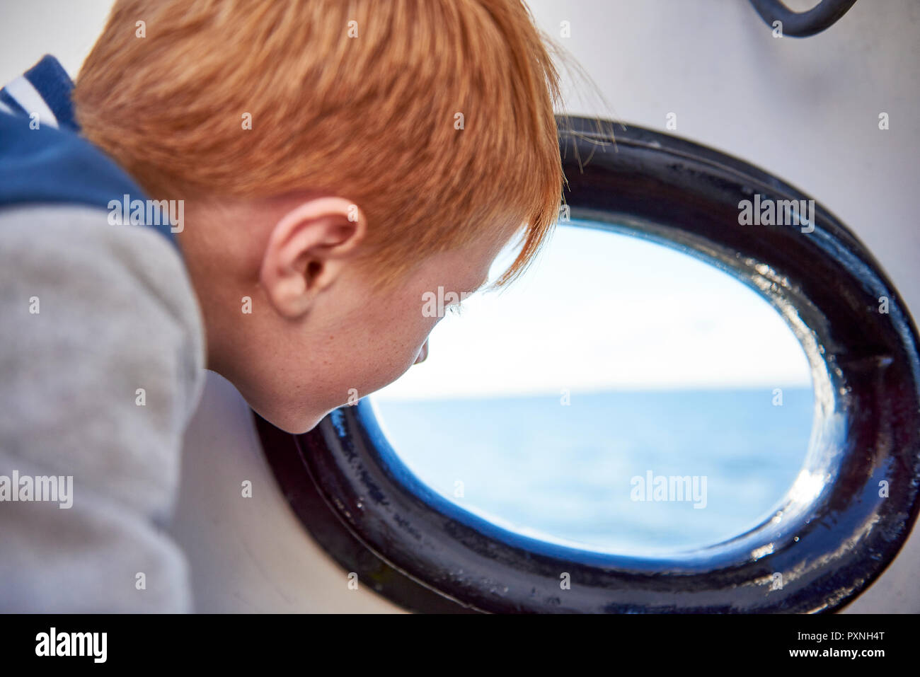 Boy looking out hi-res stock photography and images - Alamy