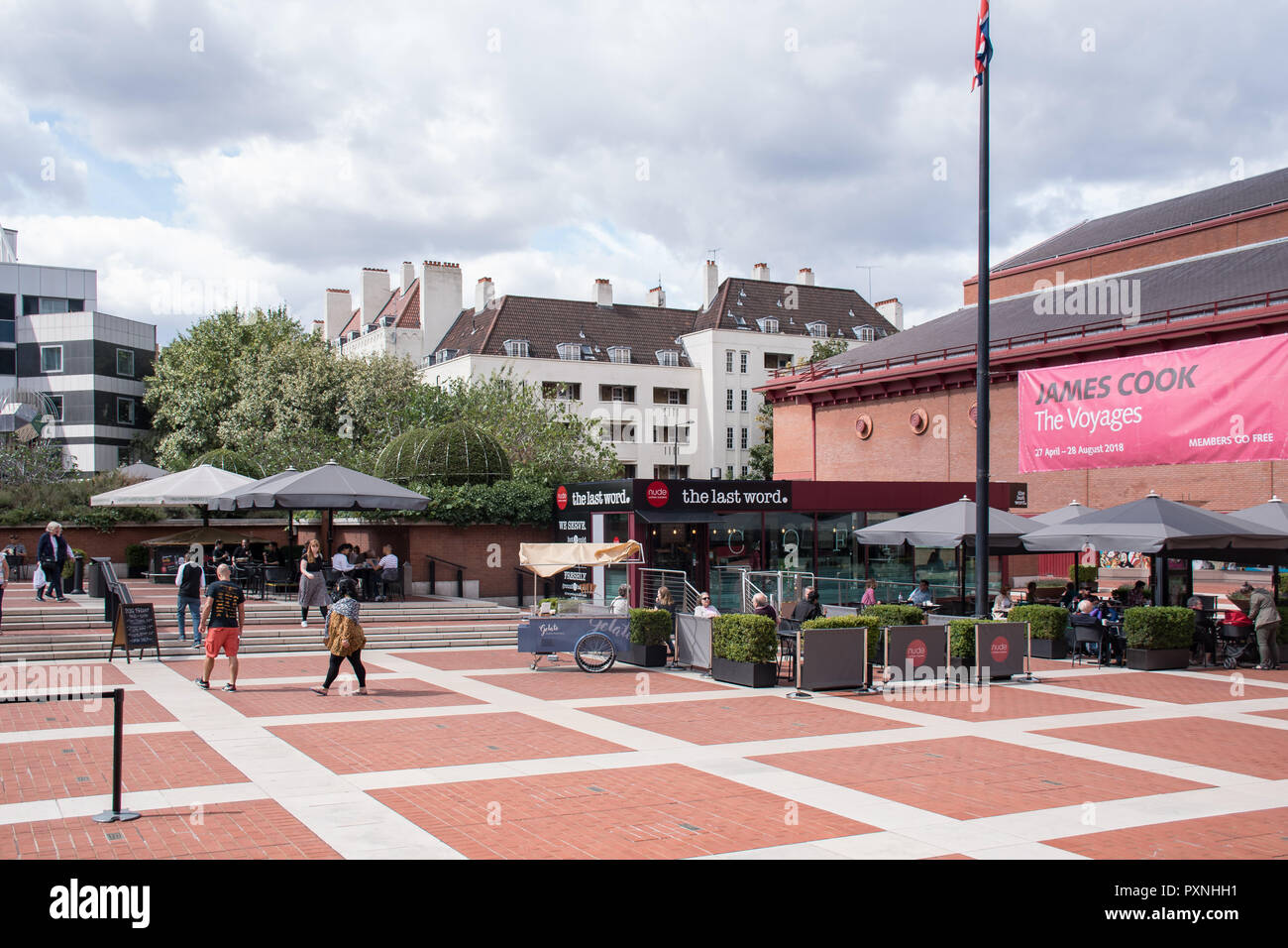 The main outdoor courtyard of the British Library with people walking ...