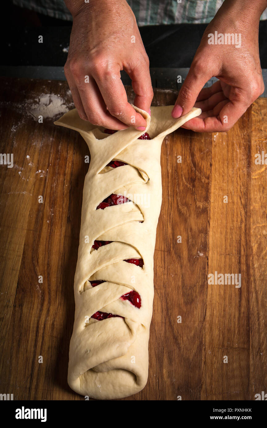 Woman forms a pigtail Stock Photo - Alamy