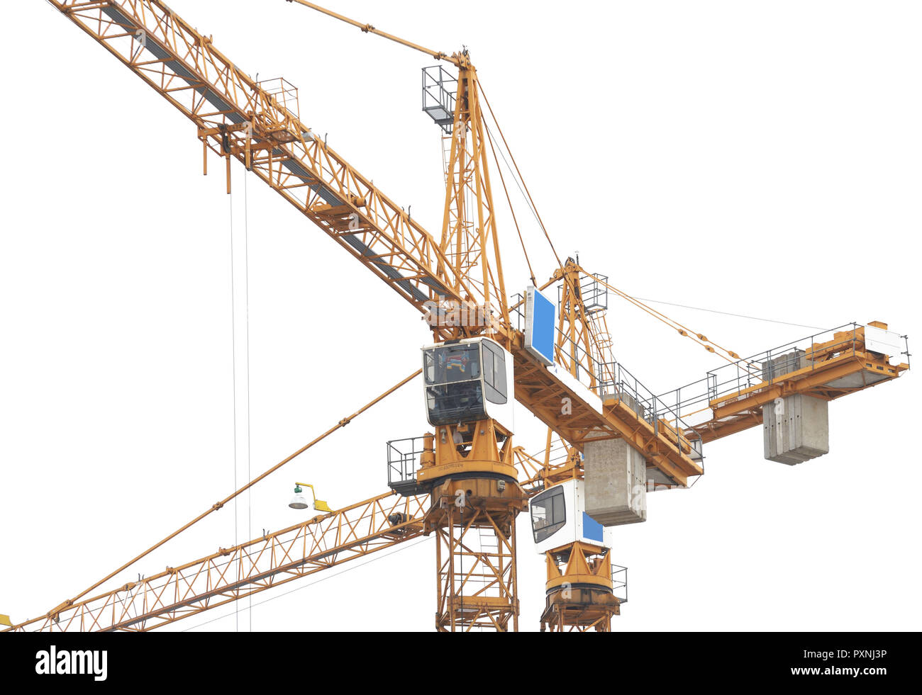Construction crane on white background.It is used to lift loads at the ...