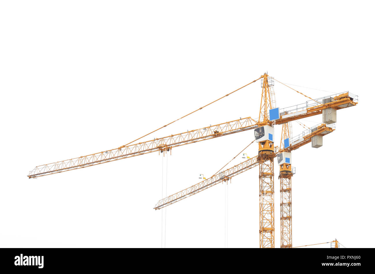 Construction crane on white background.It is used to lift loads at the ...
