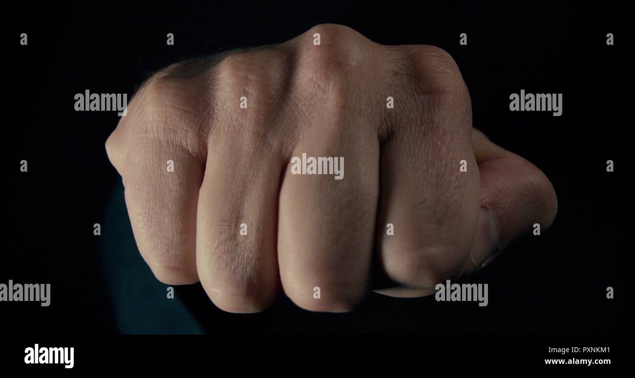 Male fist punching in a powerful aggressive manor Stock Photo - Alamy