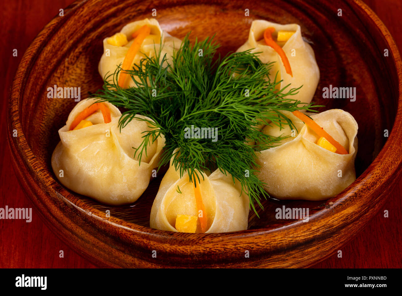 Uzbek traditional dumplings - Manti with meat Stock Photo - Alamy