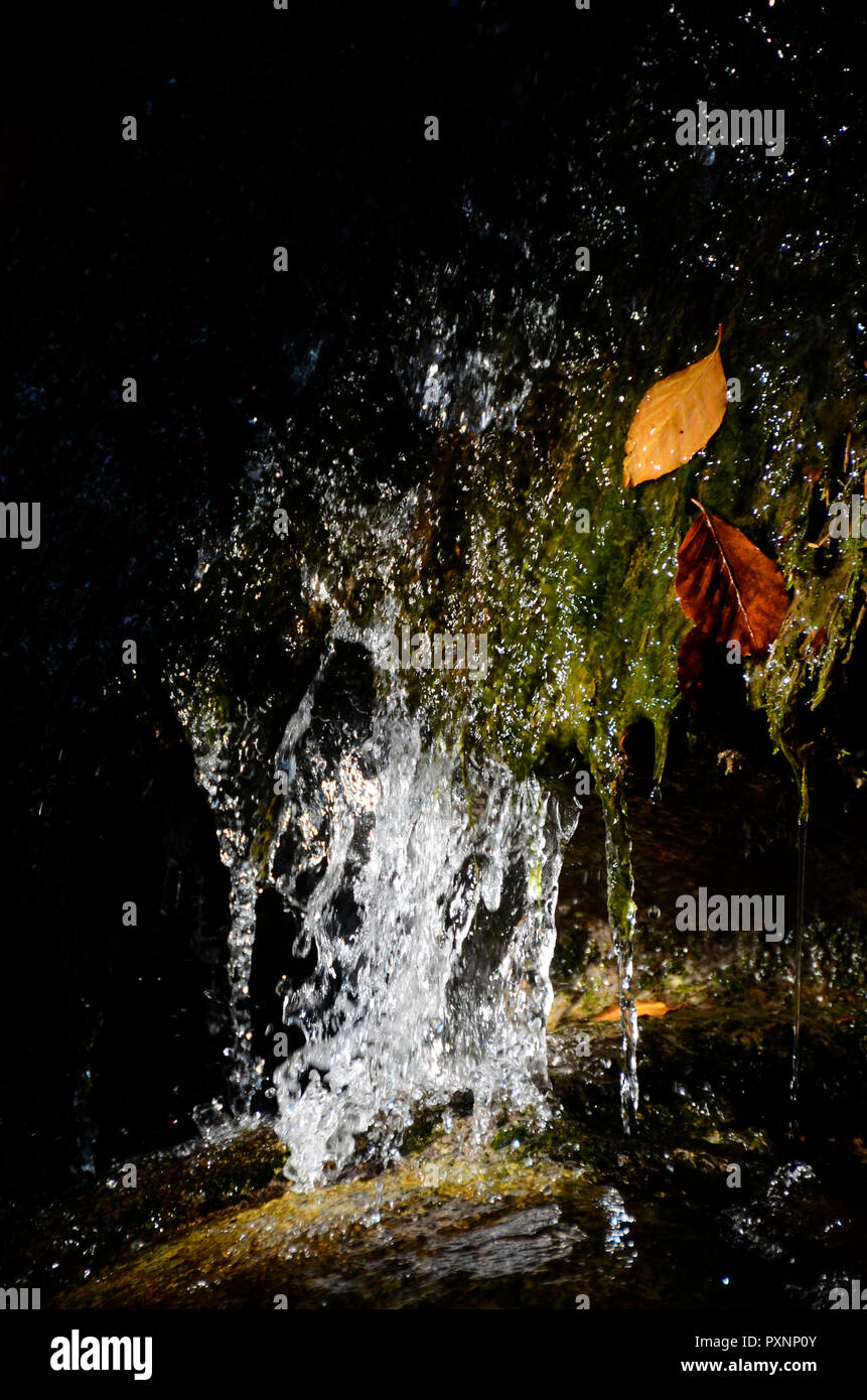 autumn waterfall, leaves and rocks in Thones, savoy, france Stock Photo ...