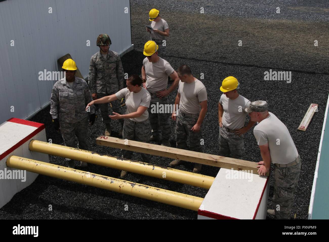 Airmen of the 211th Engineering Installation Squadron work on team ...