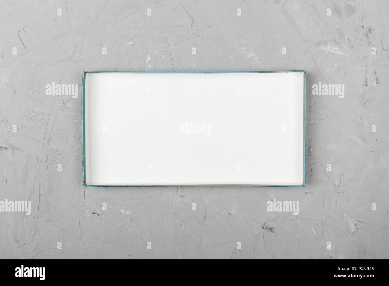 White rectangular empty open box, top view on white wooden background ...
