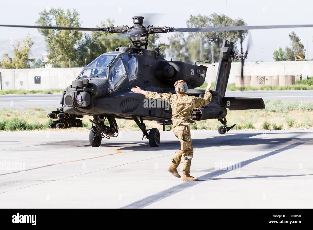 A U.S. Army AH-64E Apache helicopter crew chief assigned to Task Force ...