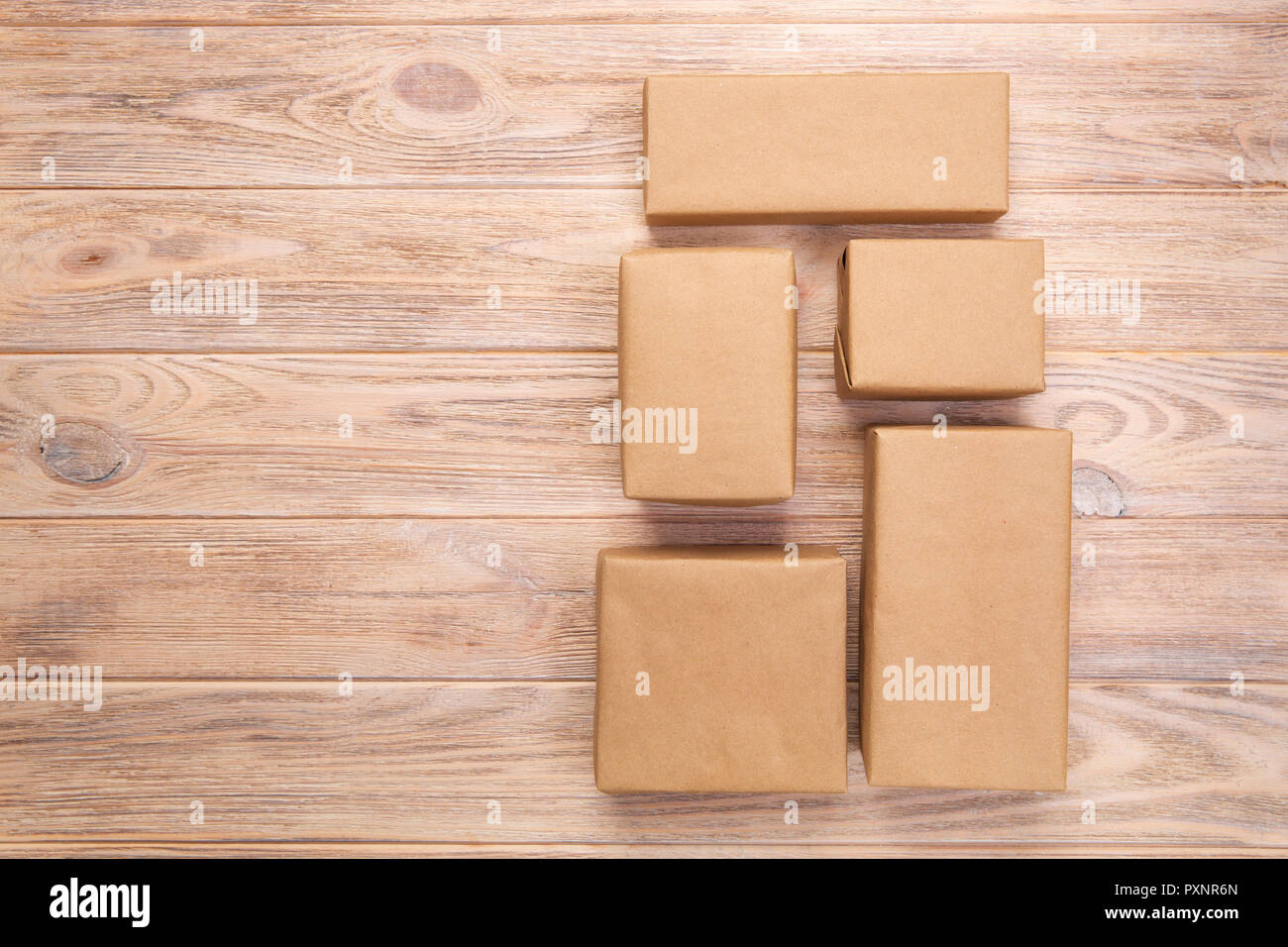 cardboard box on white wooden background, Brown mail package top view ...
