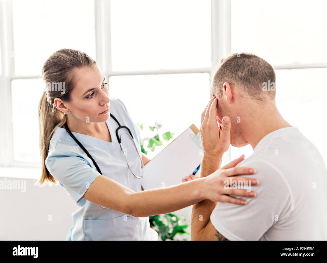 men with doctor having a head problem Stock Photo - Alamy