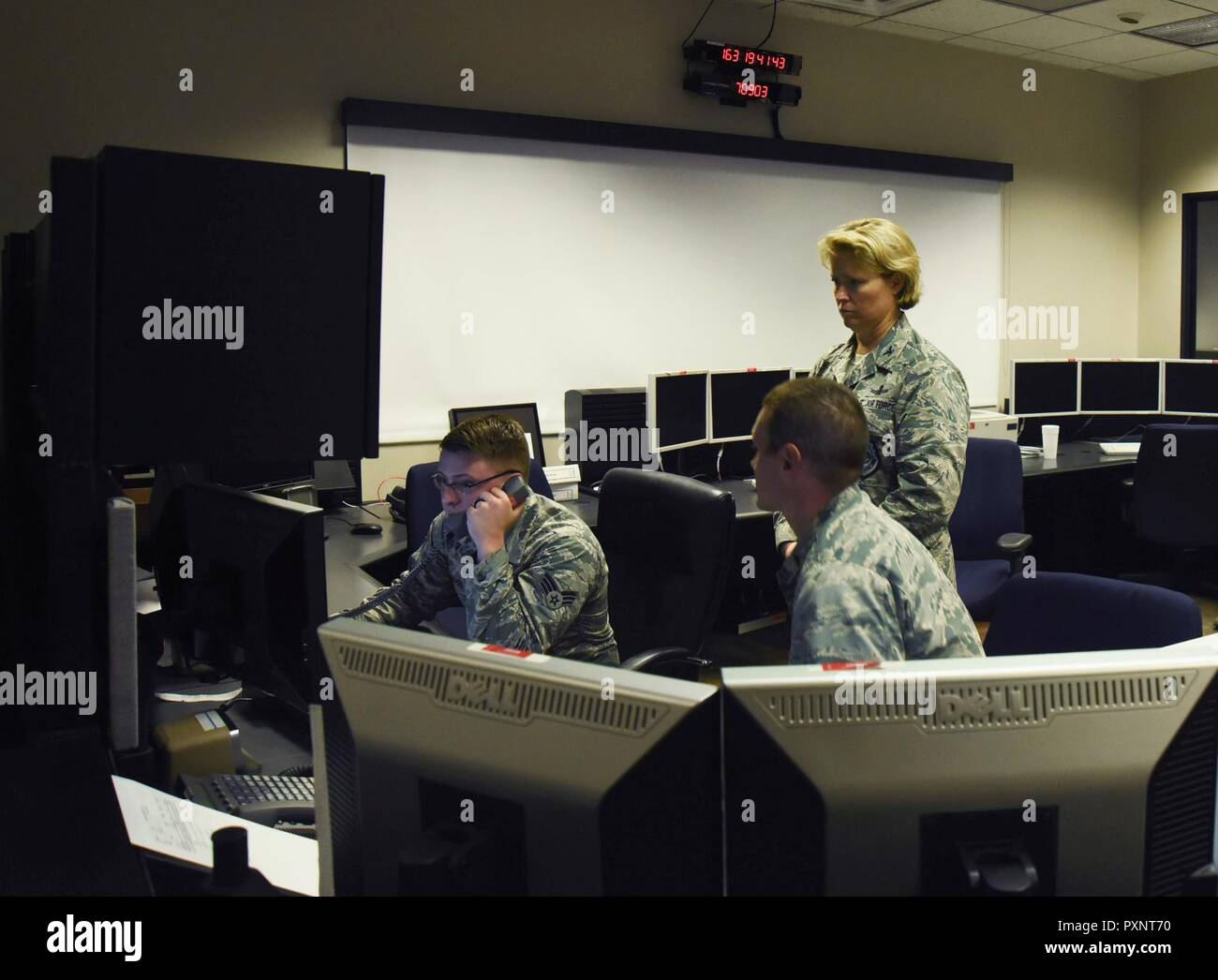 Col. DeAnna Burt, 50th Space Wing Commander, prepares to give the final ...
