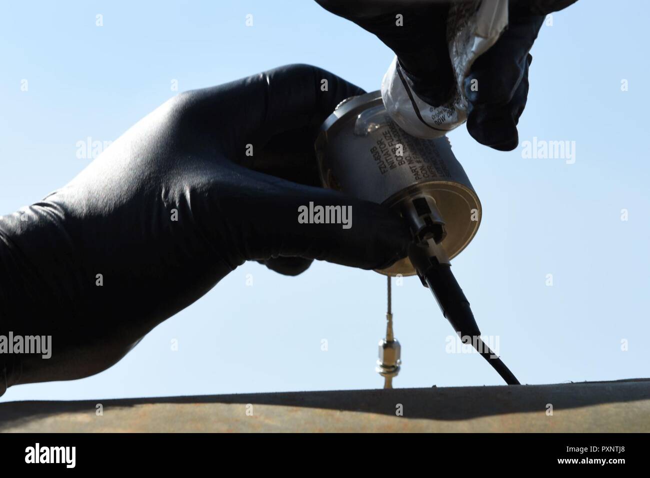 U.S. Air Force Col. David Eaglin, 39th Air Base Wing commander, applies ...