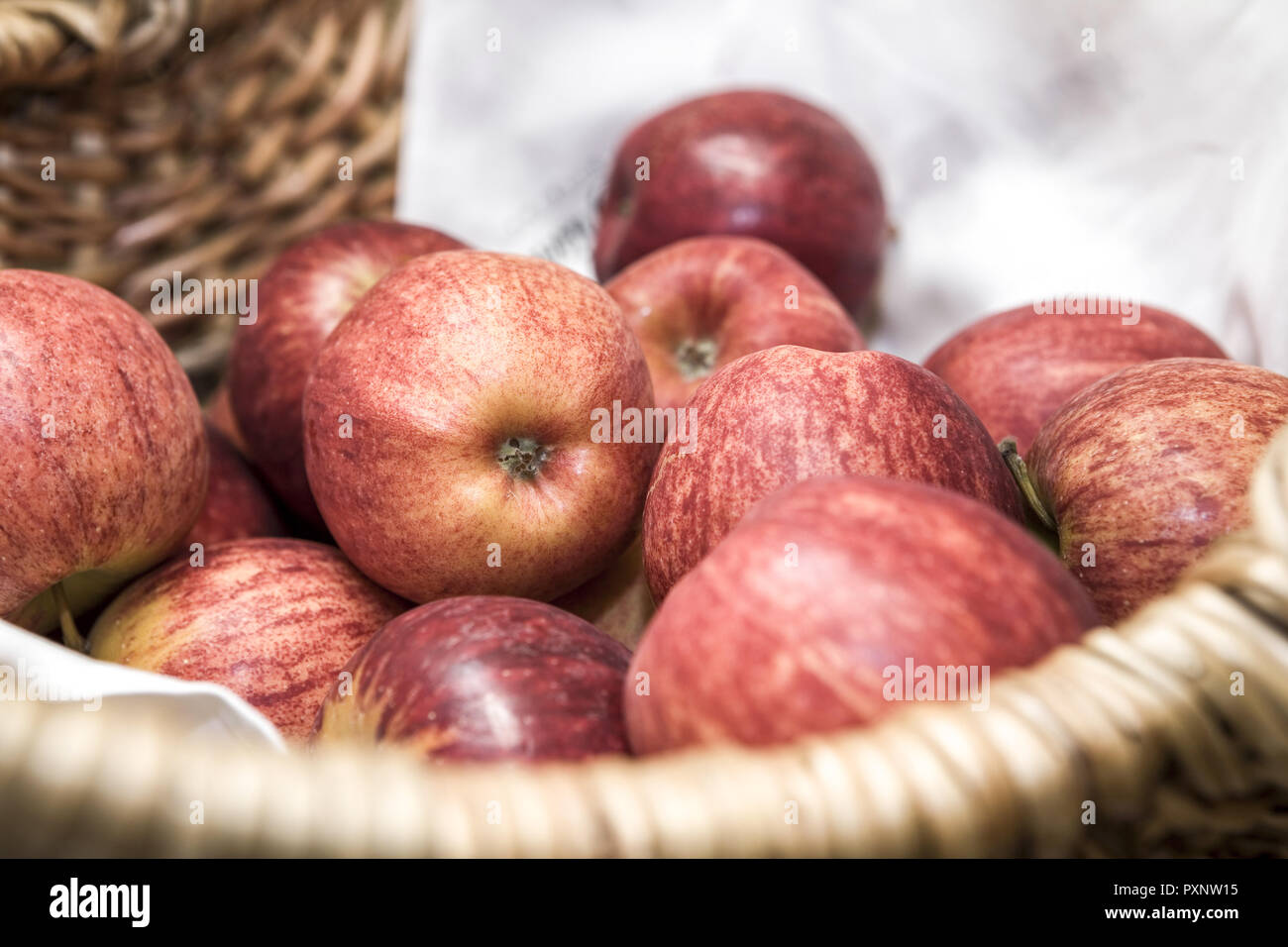 Red apples in basket Stock Photo - Alamy