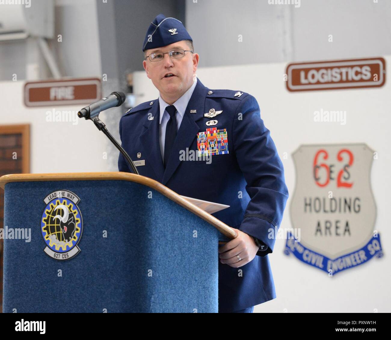 Presiding Official Col. William Percival, Commander, 627th Air Base Group, delivers remarks ...