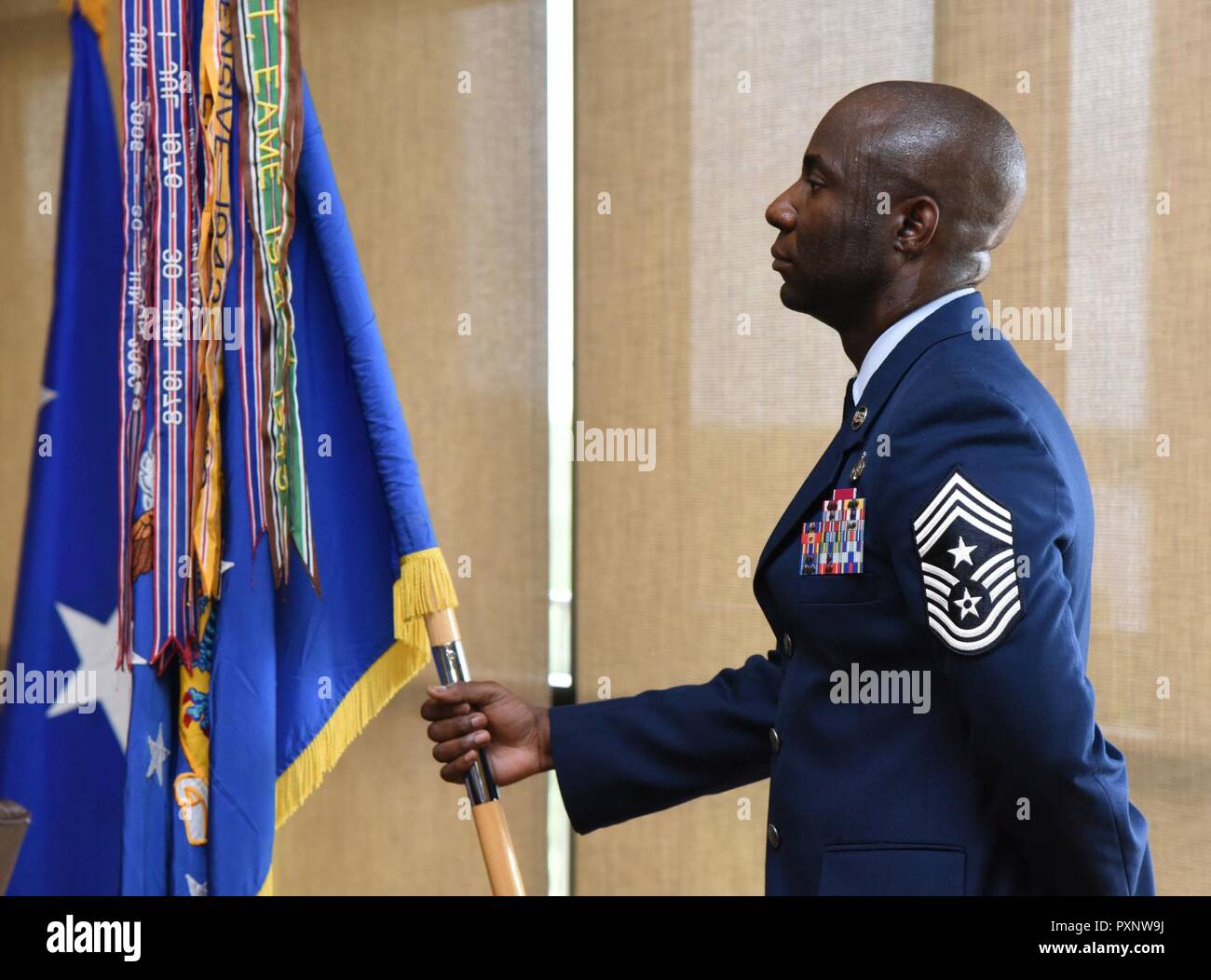 Chief Master Sgt. Vegas Clark, 81st Training Wing command chief, holds ...