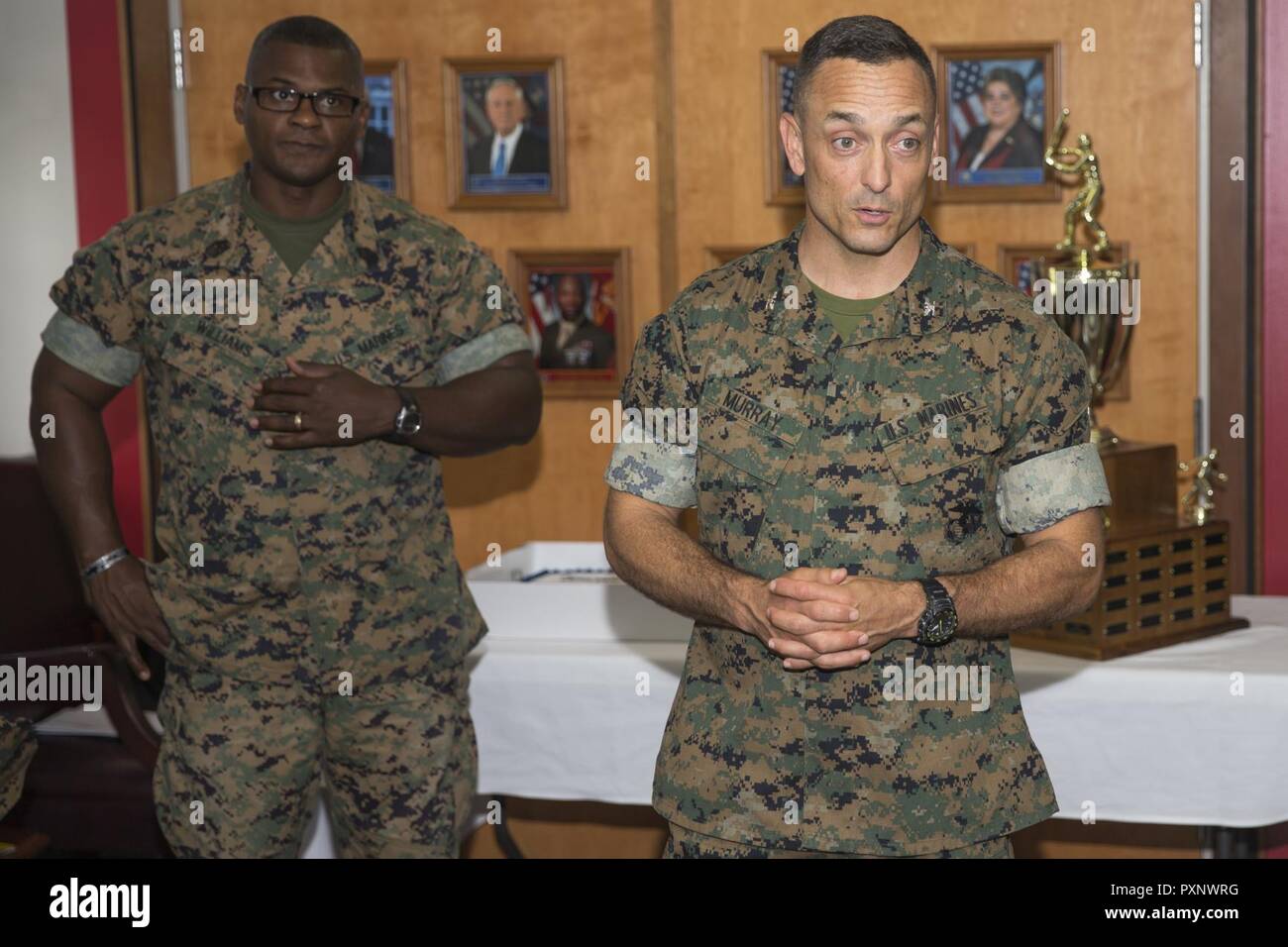 U.S. Marine Corps Col. Joseph M. Murray, right, commanding officer ...