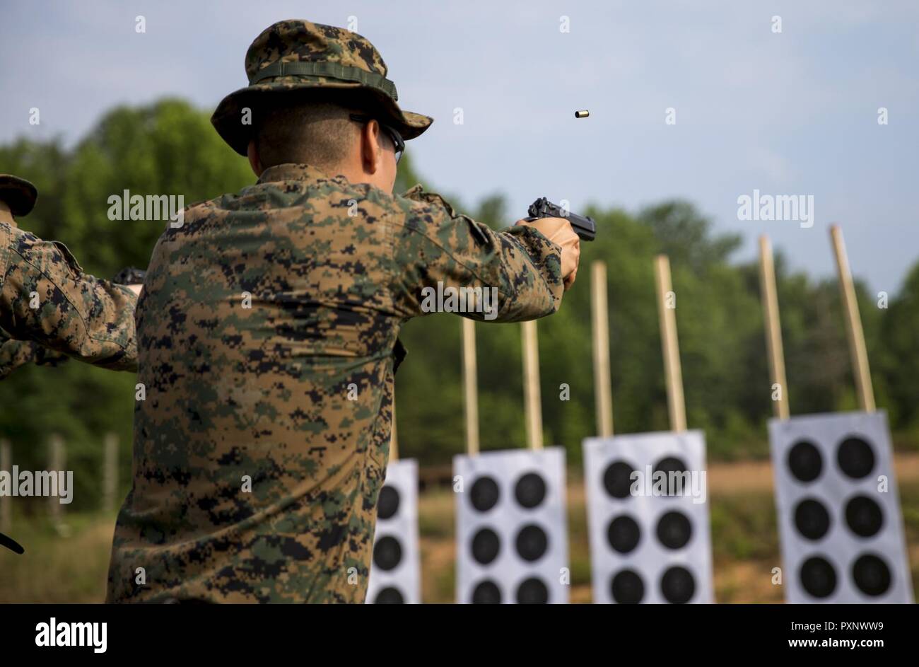 A U.S. Marine with Marine Corps Embassy Security Group (MCESG) sights ...