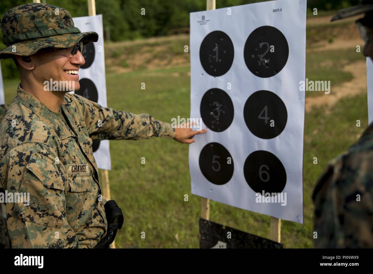 A U.S. Marine with Marine Corps Embassy Security Group (MCESG) observes ...