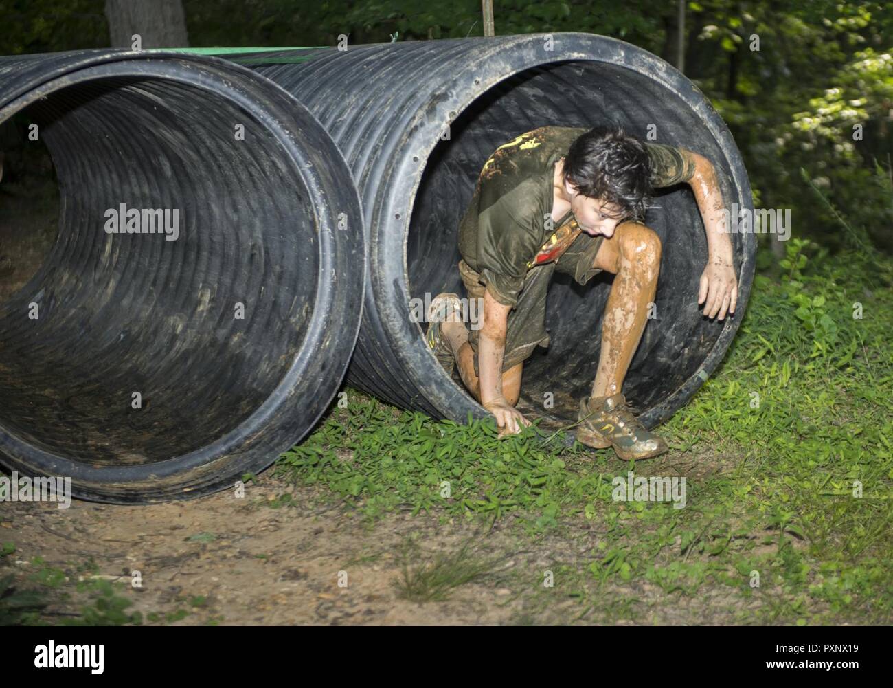 A participant maneuvers through an obstacle during the annual Marine ...