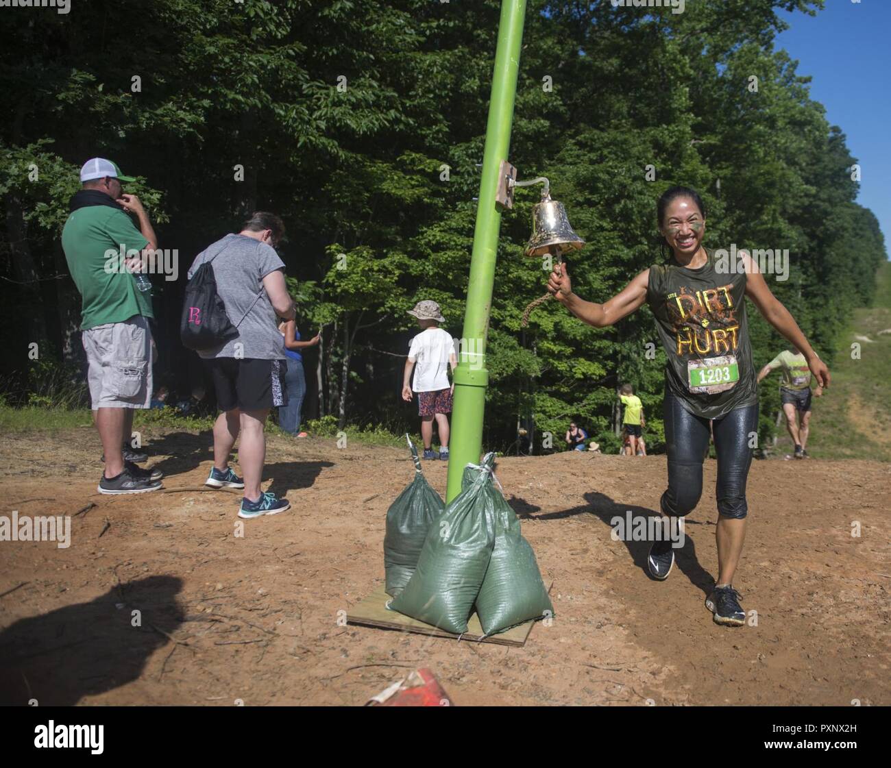 A participant rings a bell during the annual Marine Corps Marathon (MCM ...