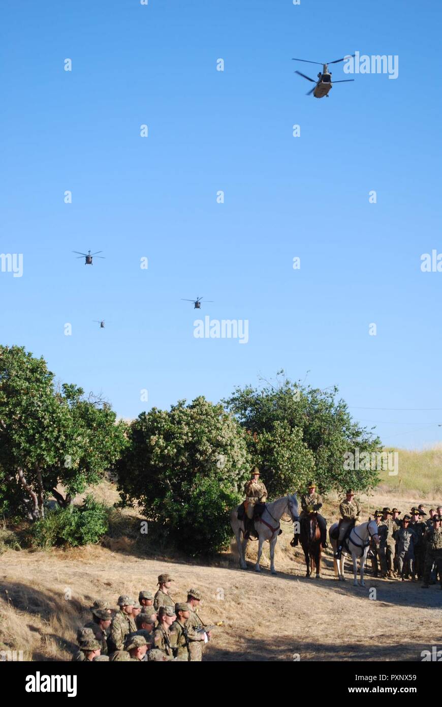 Helicopters from the 40th Combat Aviation Brigade conduct a fly over ...