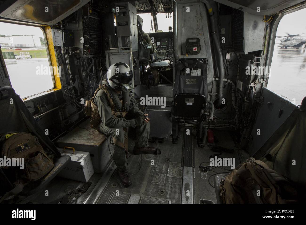 MCAS FUTENMA, OKINAWA, Japan— Staff Sgt. Jahbari H. Codes sits inside a ...