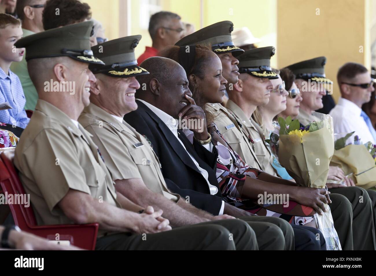 U.S service members and civilians attend a change of command ceremony ...