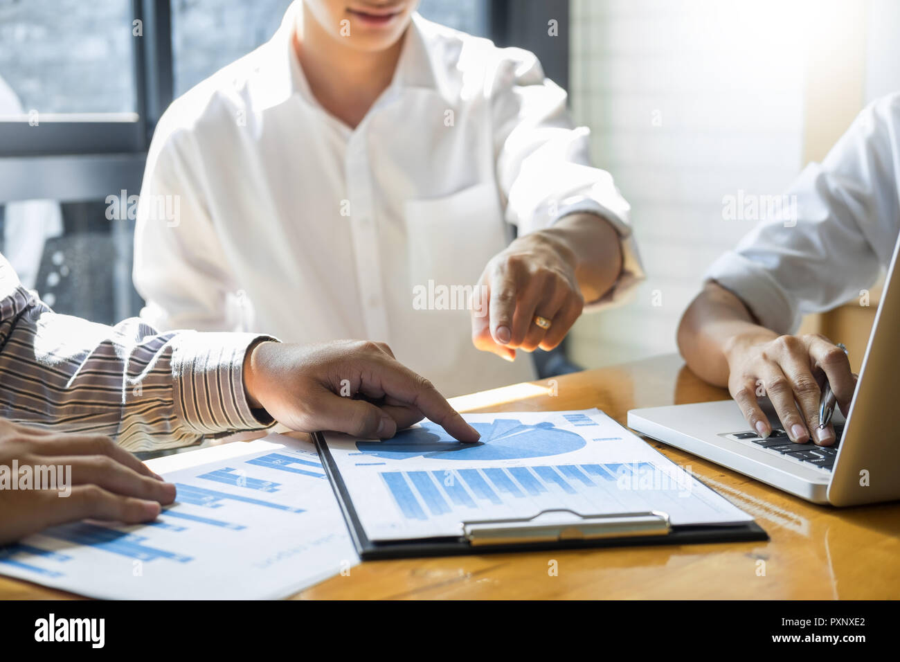 Business Team Meeting Using Laptop Discussion together while going ...