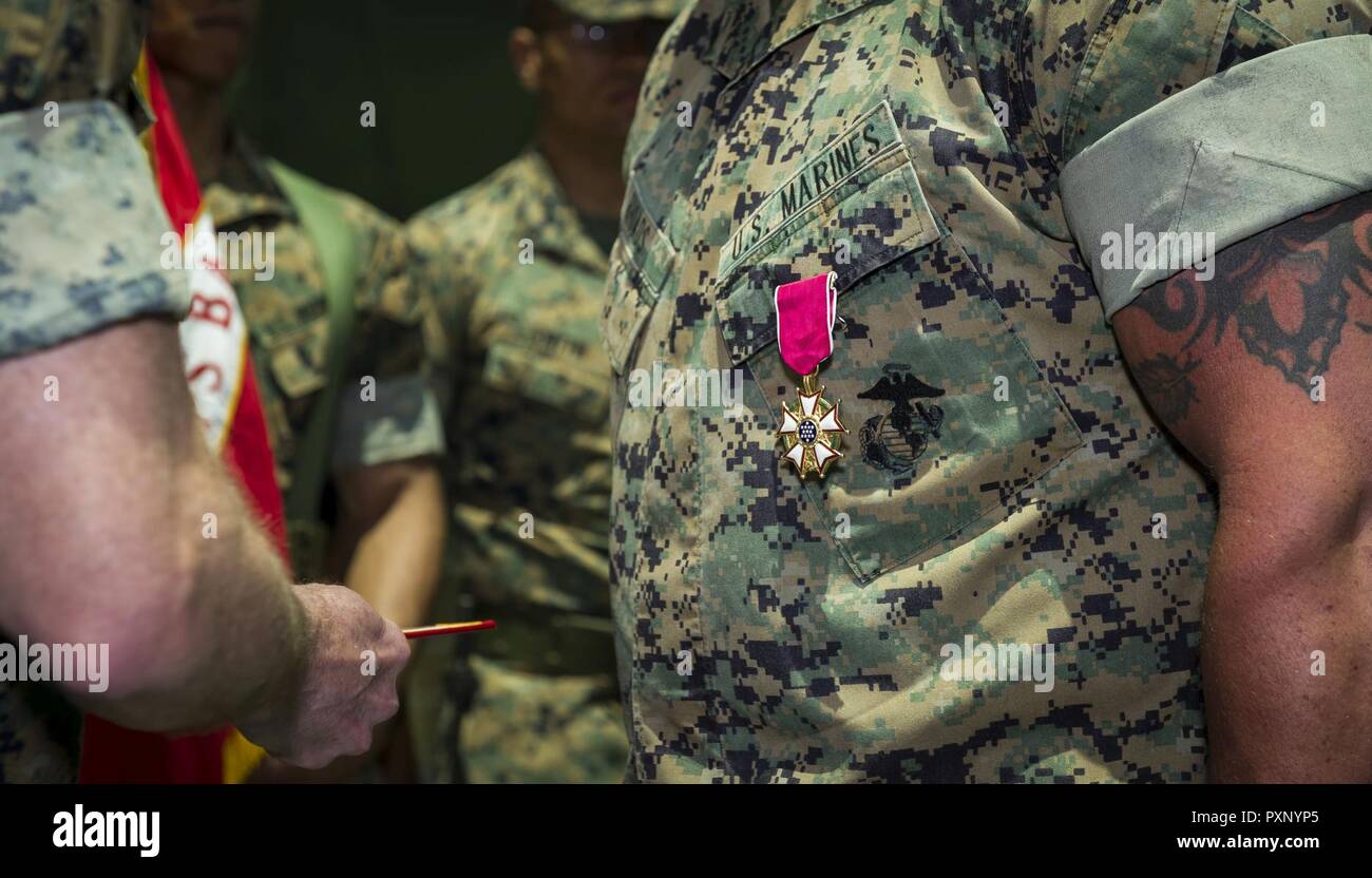 U.S. Marine Corps Master Gunnery Sgt. Steven Rhoads, right ...