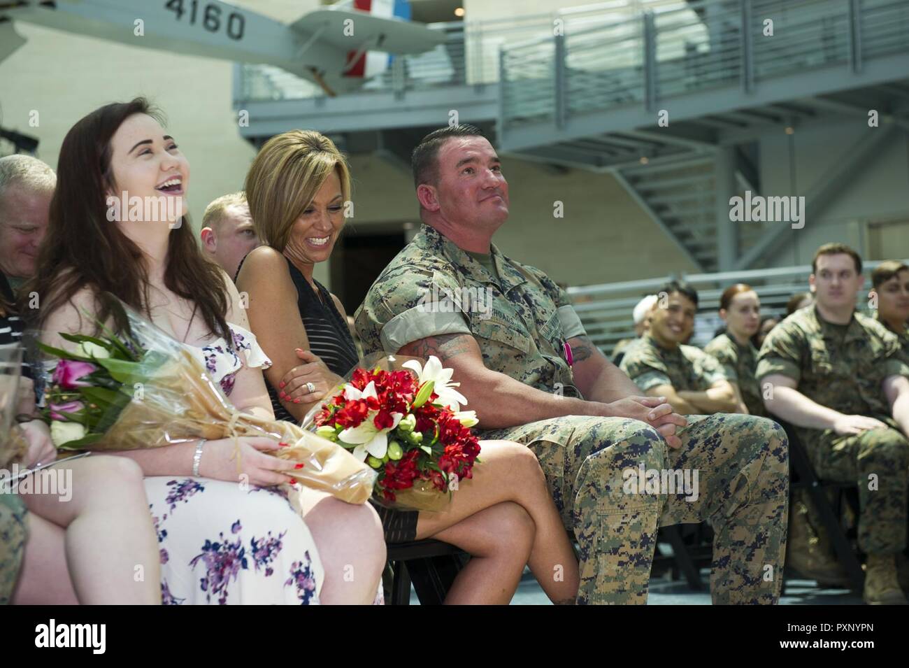 U.S. Marine Corps Master Gunnery Sgt. Steven Rhoads, center ...