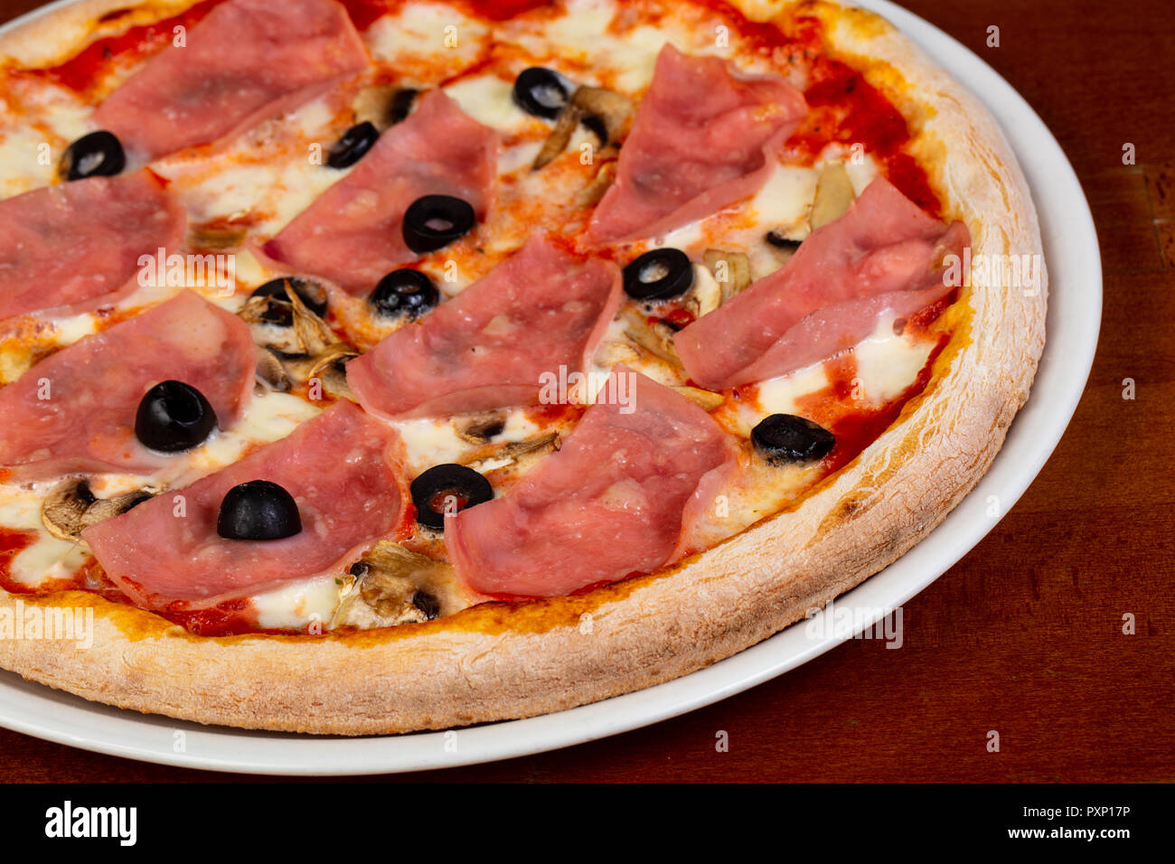 Pizza with ham and cheese Stock Photo - Alamy
