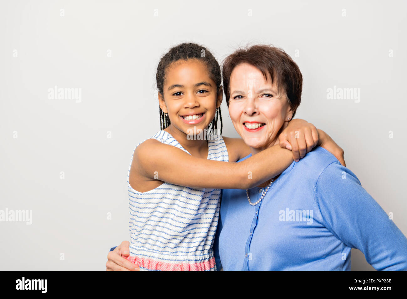 black girl child with grandmother in studio white background Stock ...