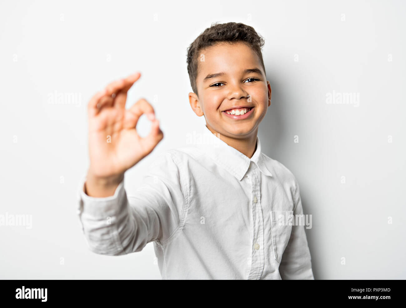 black boy perfect hand sign on studio white background Stock Photo - Alamy