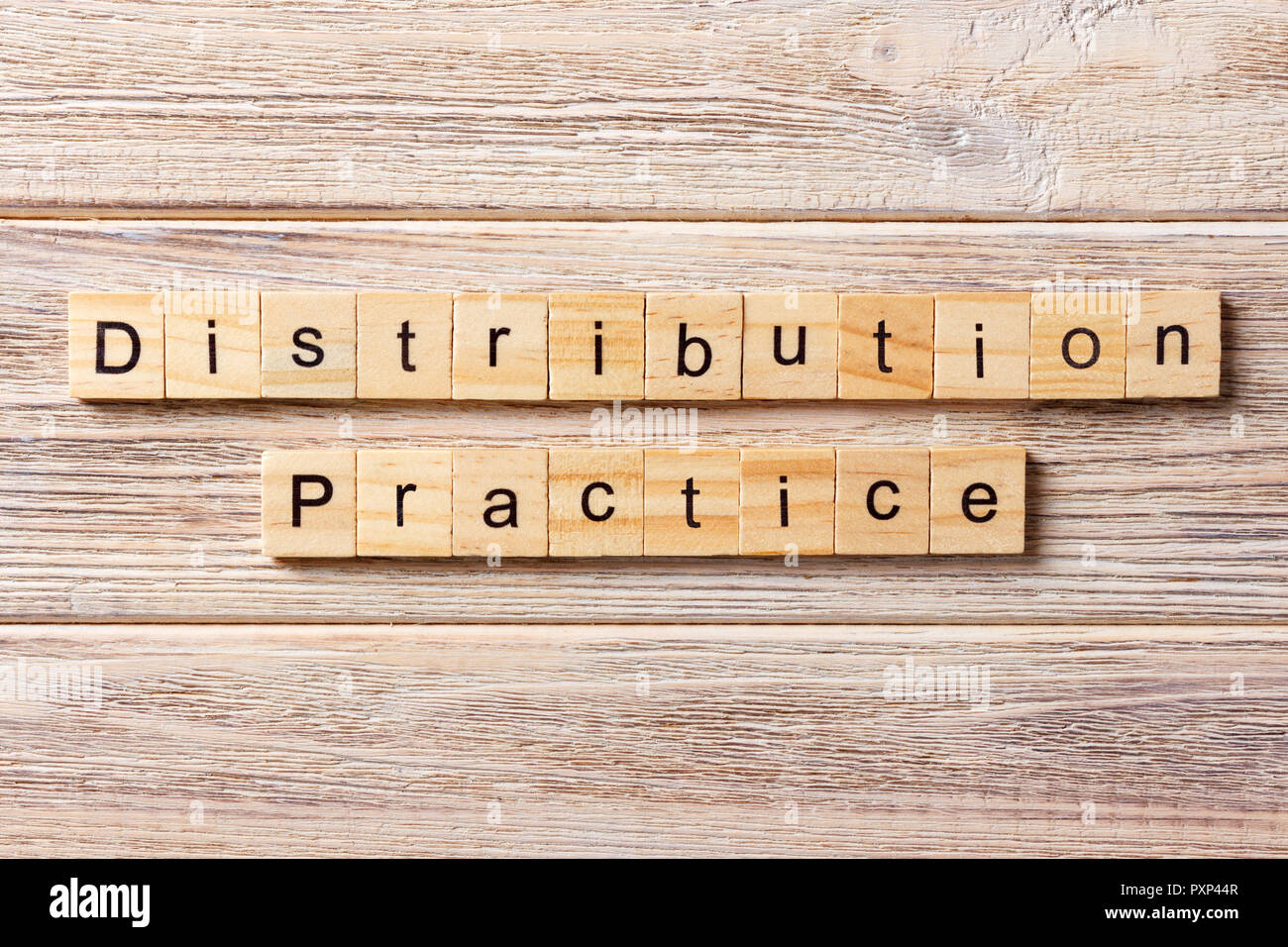 distribution practice word written on wood block. distribution practice ...