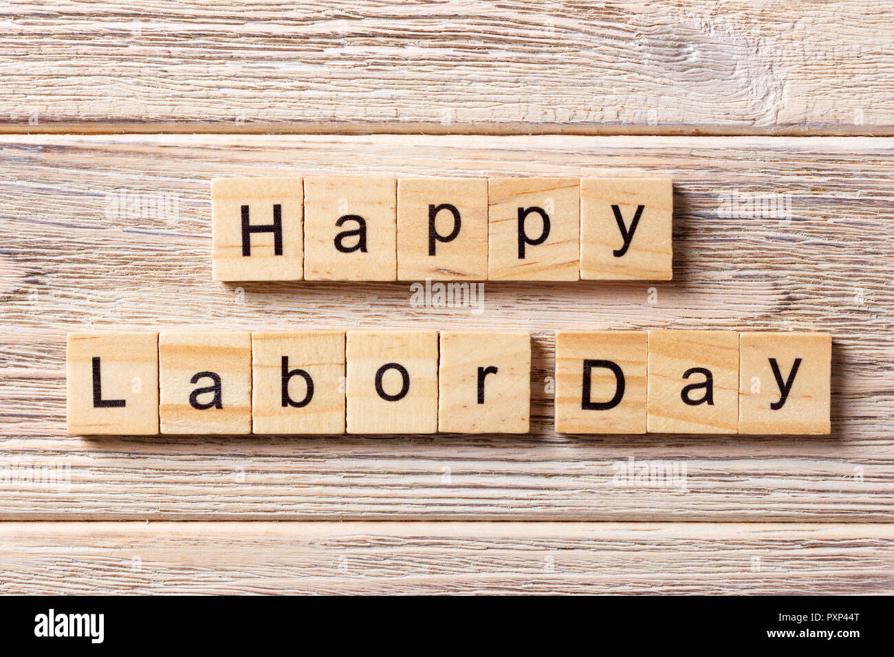 Happy Labor Day word written on wood block. Happy Labor Day text on ...